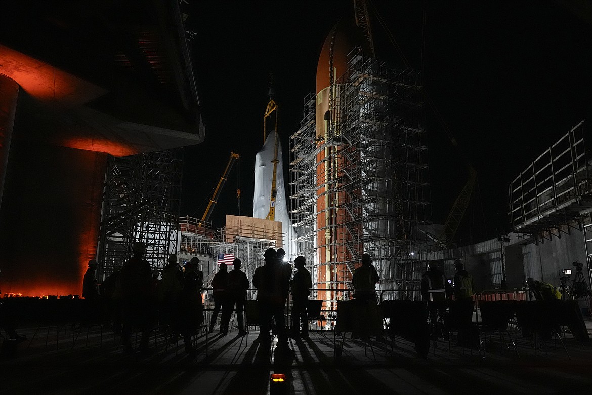 Space shuttle Endeavour hoisted for display in launch configuration at ...