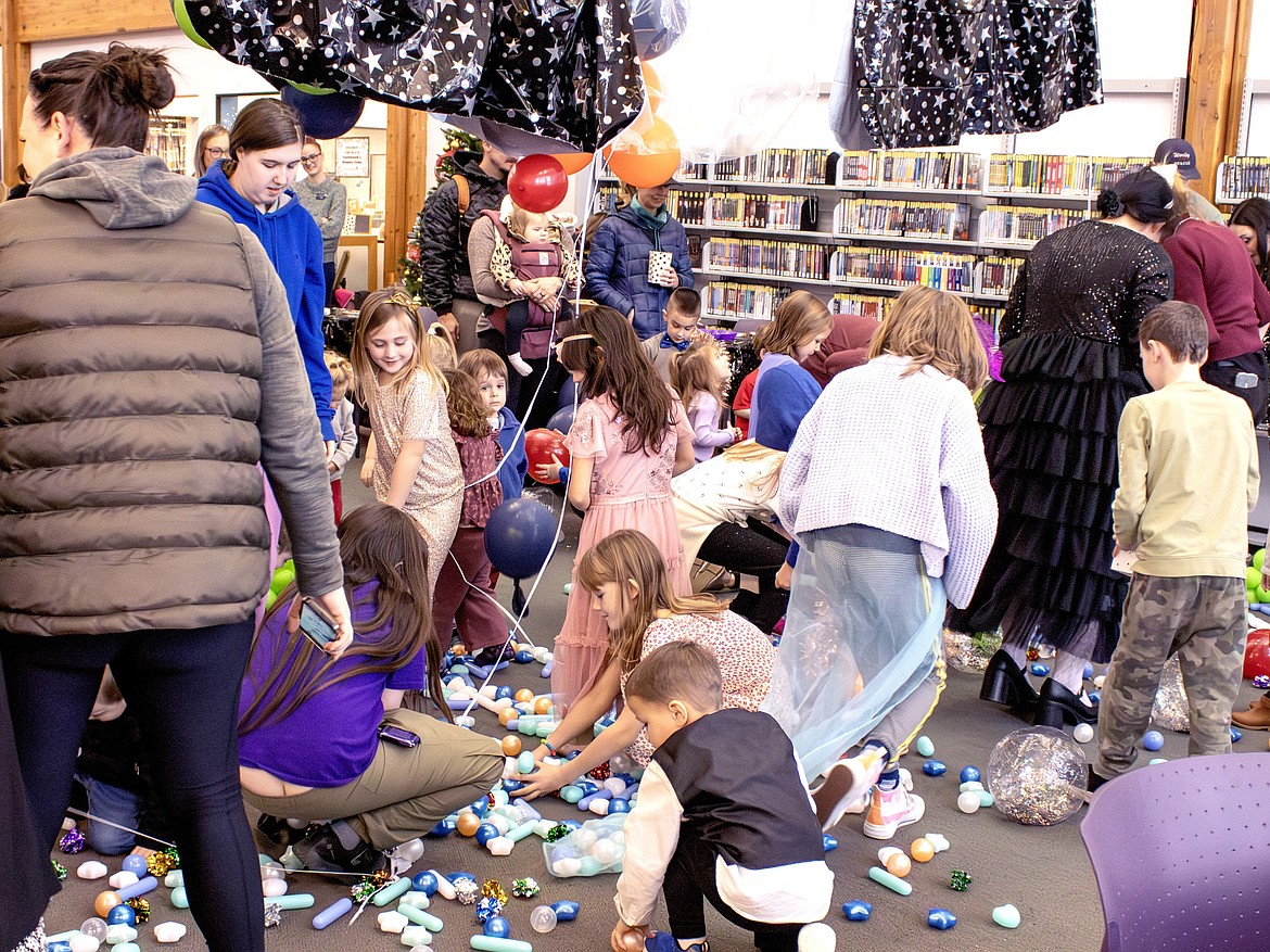 Kids watch balloons drop at the Hayden 'Noon Year's Eve' celebration ...