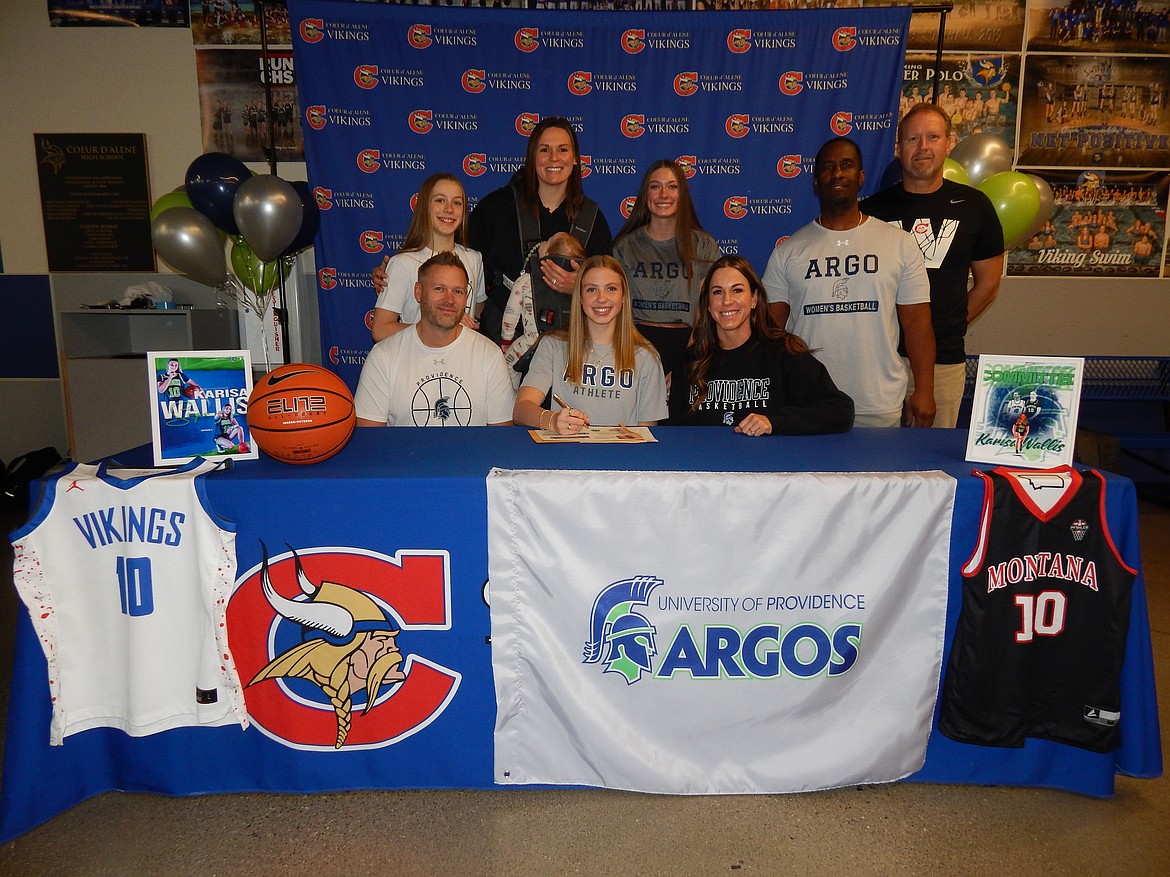 Signing photos Dec. 17, 2025 | Coeur d'Alene Press