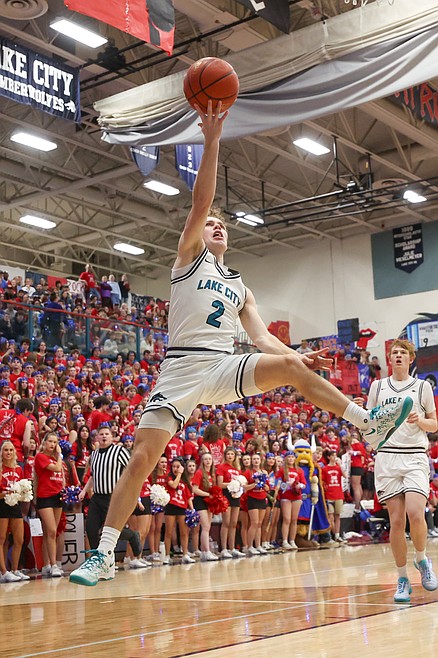 FIGHT FOR THE FISH: Lake City boys run past Coeur d'Alene; Viking girls ...